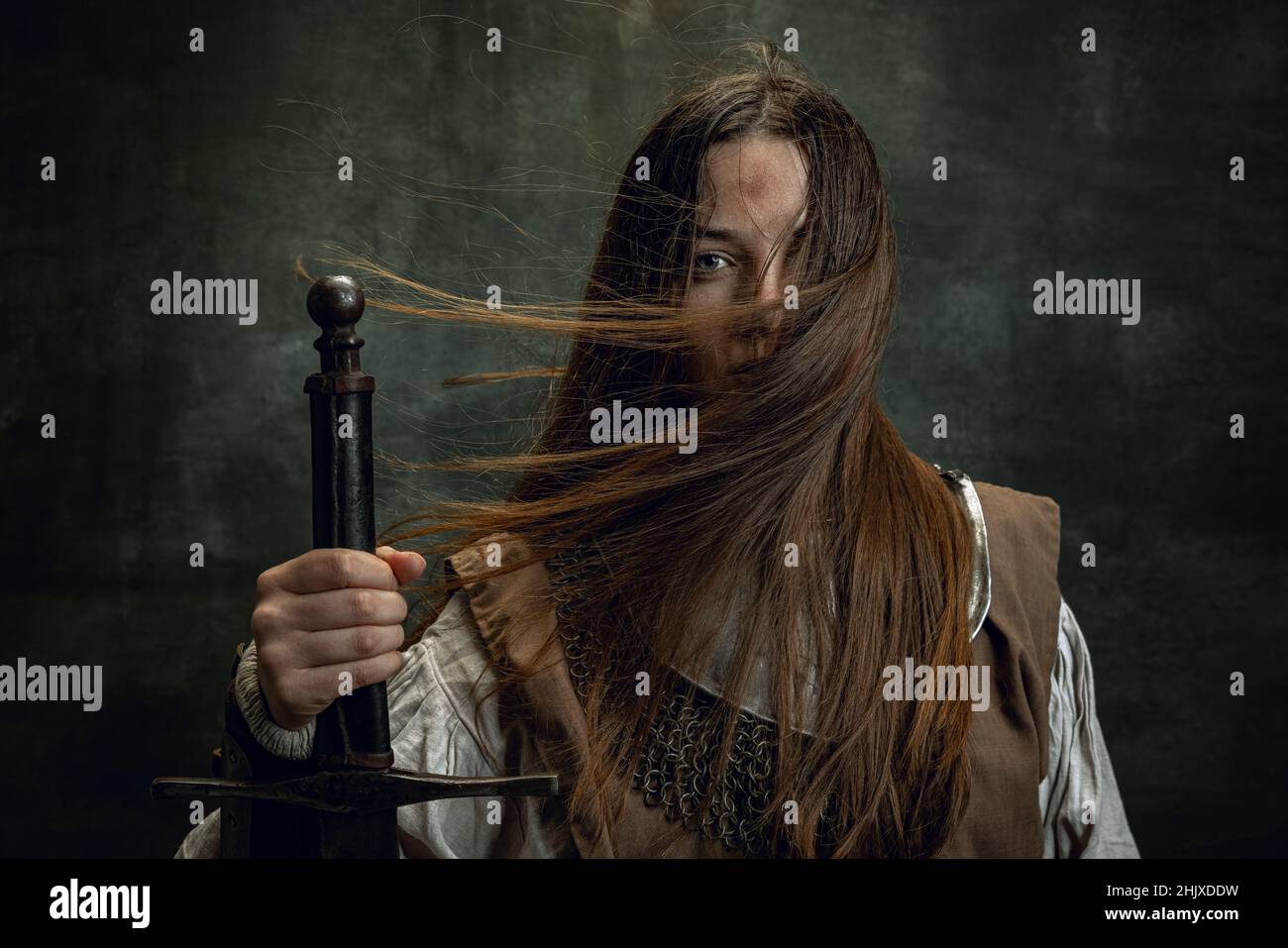 Vintage portrait of adorable woman, medieval female warrior or knight ...