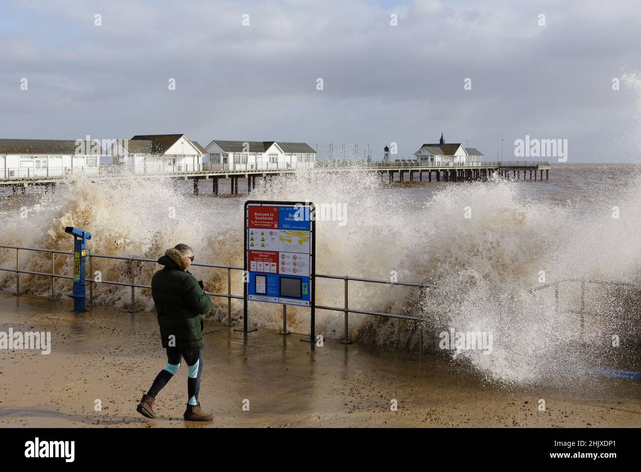 Person very close, photographing the crashing waves at high tide ...