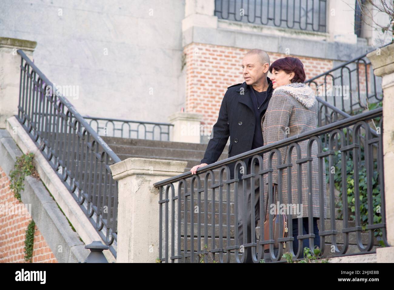 Couple leaning on railing hi-res stock photography and images - Alamy