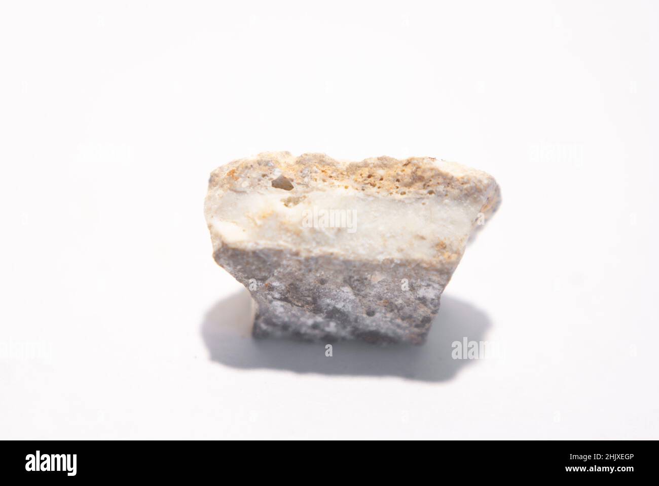 small limestone on a white background Stock Photo - Alamy