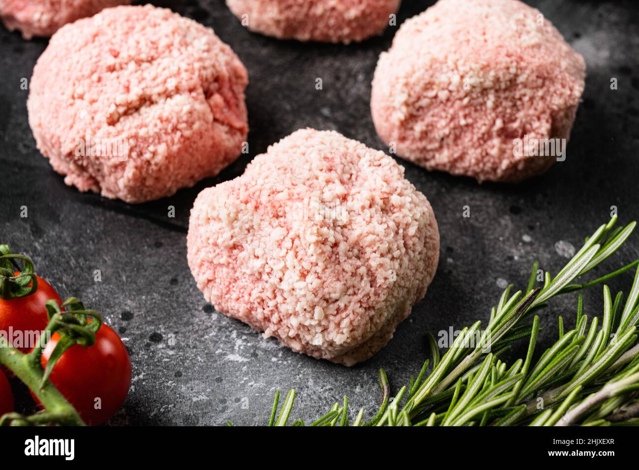 Organic minced meat meatball set, on black dark stone table background ...
