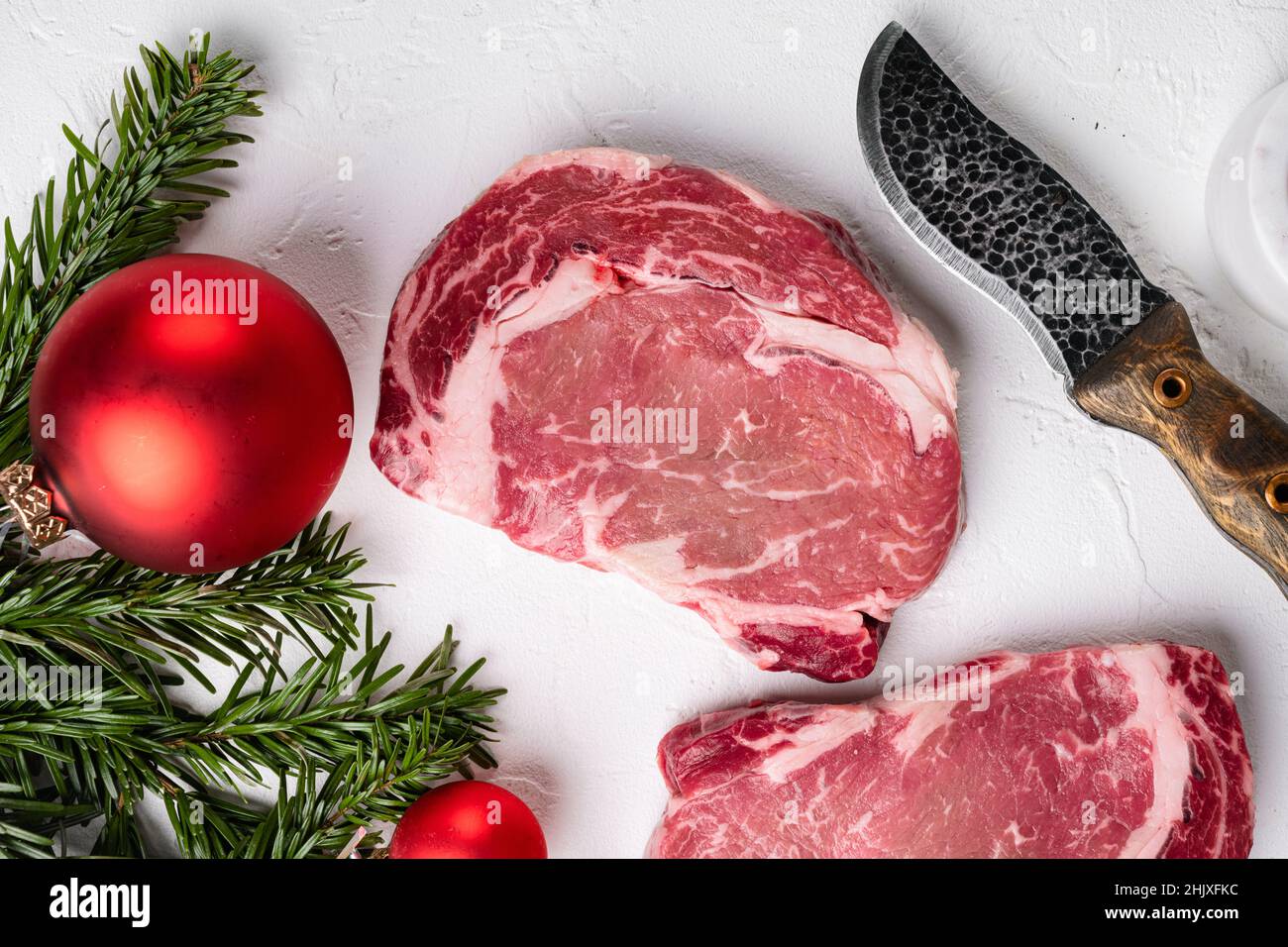Classic fresh rib eye steak with Christmas tree decorations set, on ...