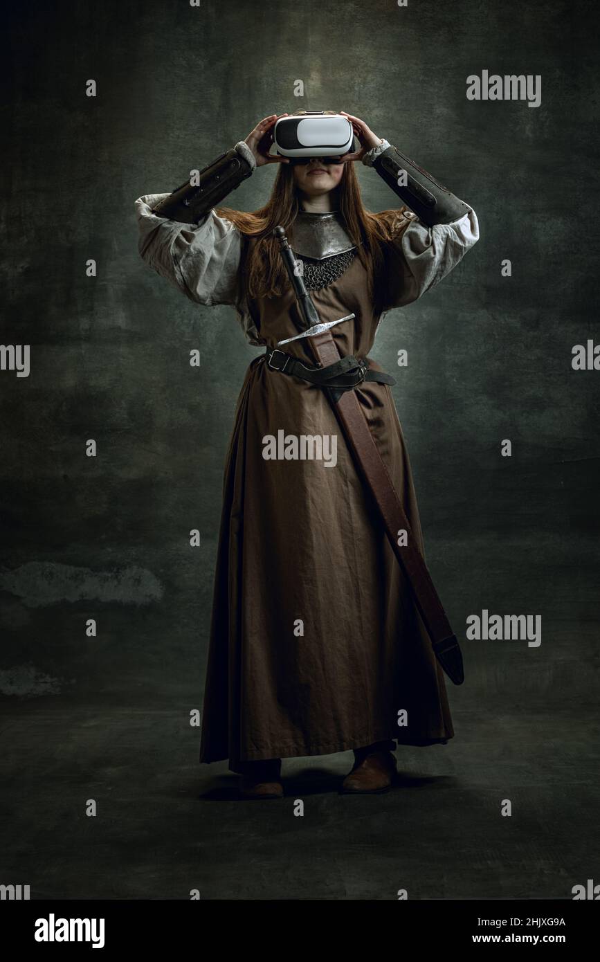 Portrait of young wman, medieval warrior, knight with long hair in VR ...
