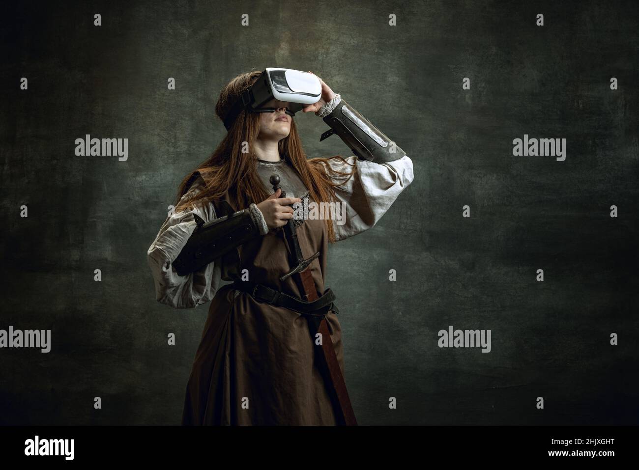Portrait of young wman, medieval warrior, knight with long hair in VR ...