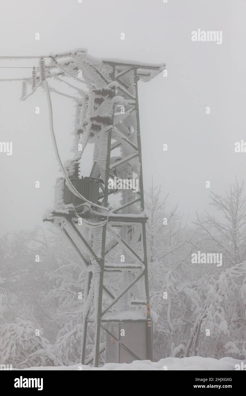Electricity pylons covered in snow hi-res stock photography and images ...