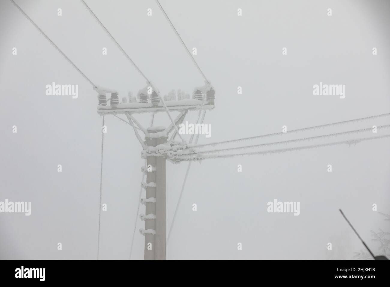 Electricity pylons covered in snow hi-res stock photography and images ...