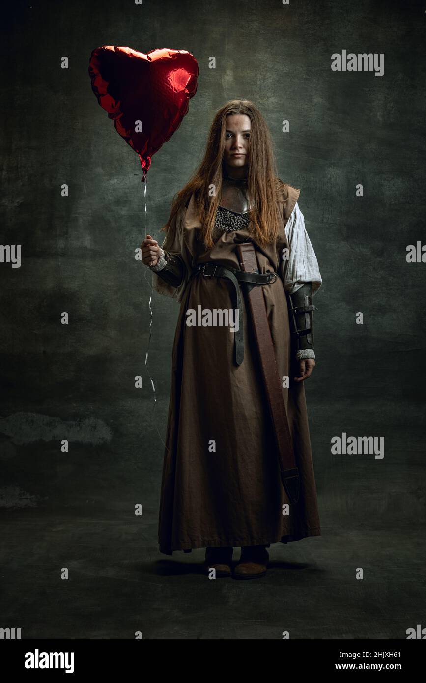 Full-length portrait of sad beautiful woman in image of medieval ...