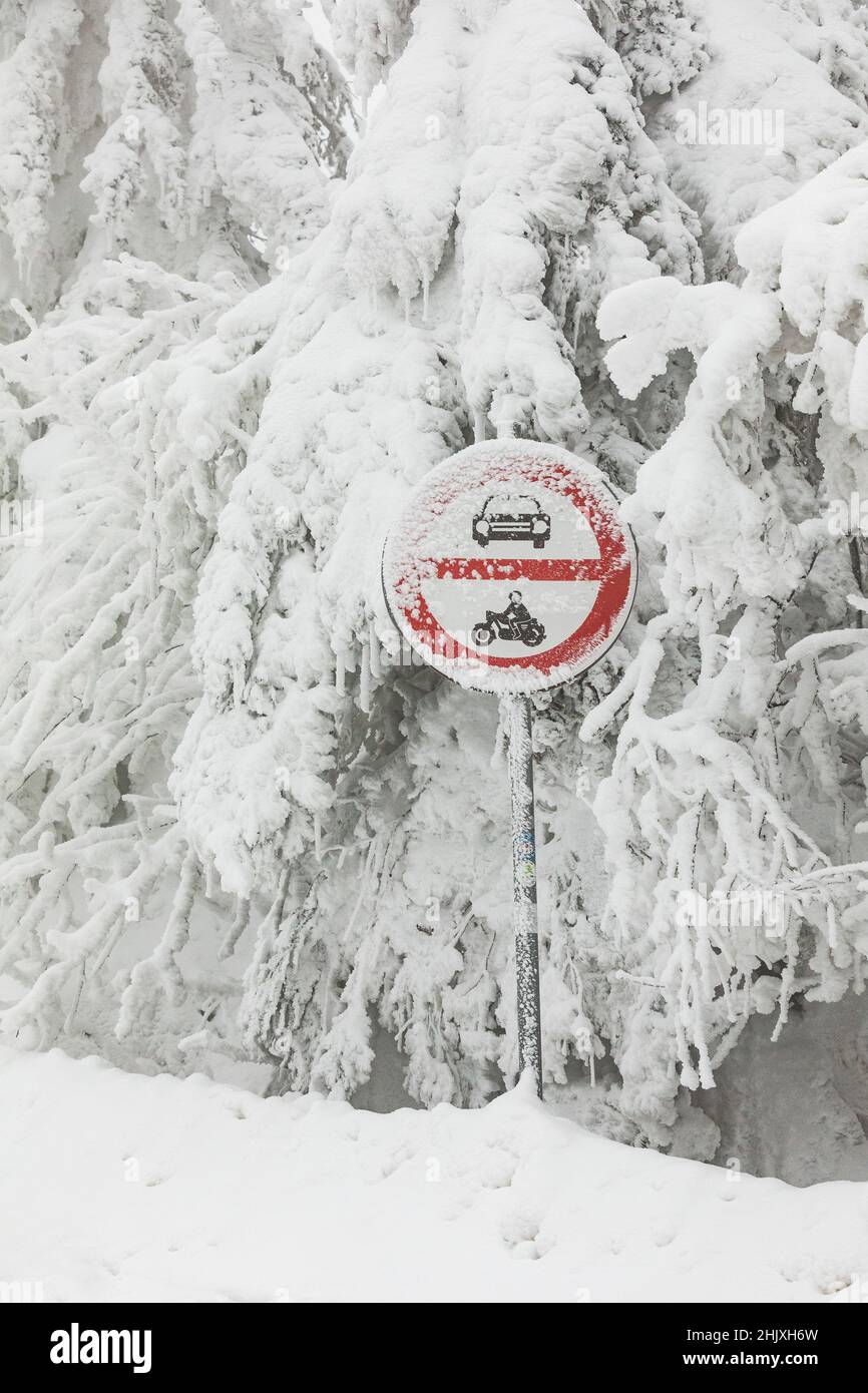 Road sign no entry covered with snow and icicles. Winter snowy ...