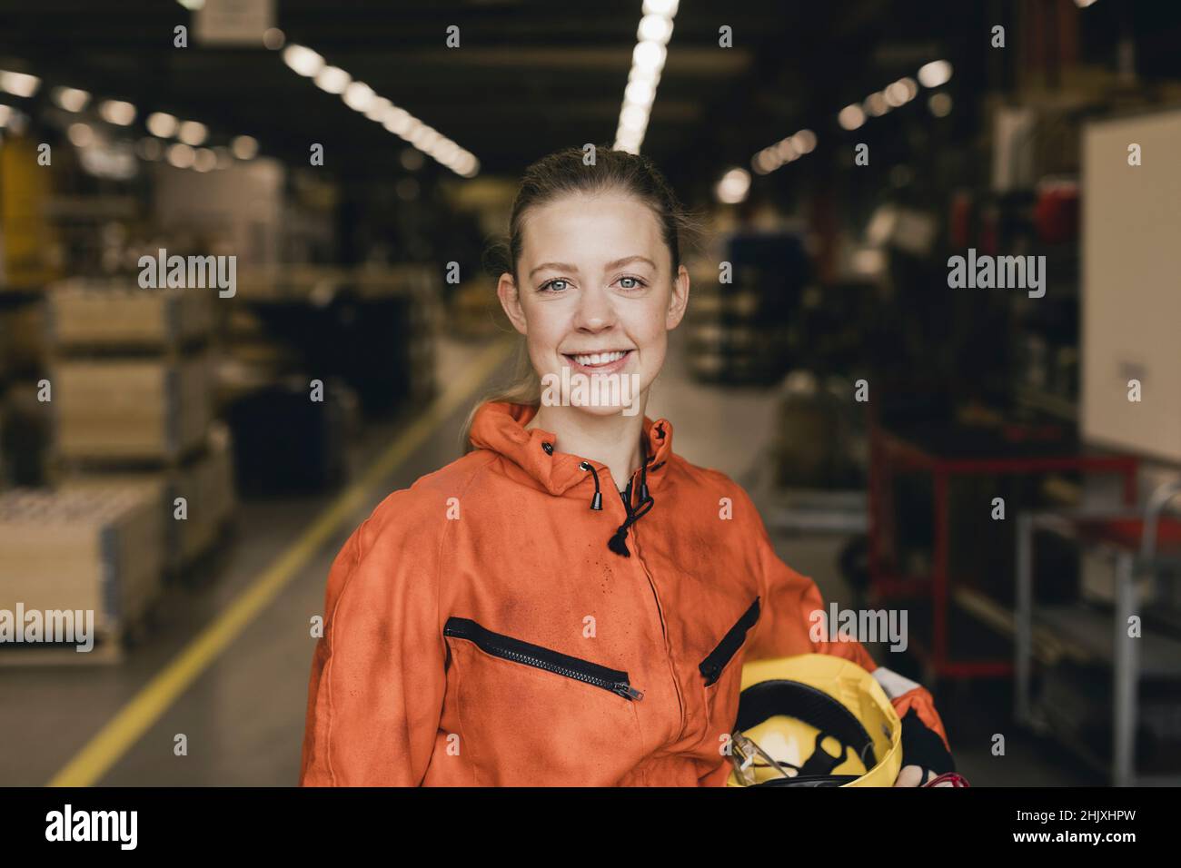 Young smiling worker industrial hi-res stock photography and images - Alamy