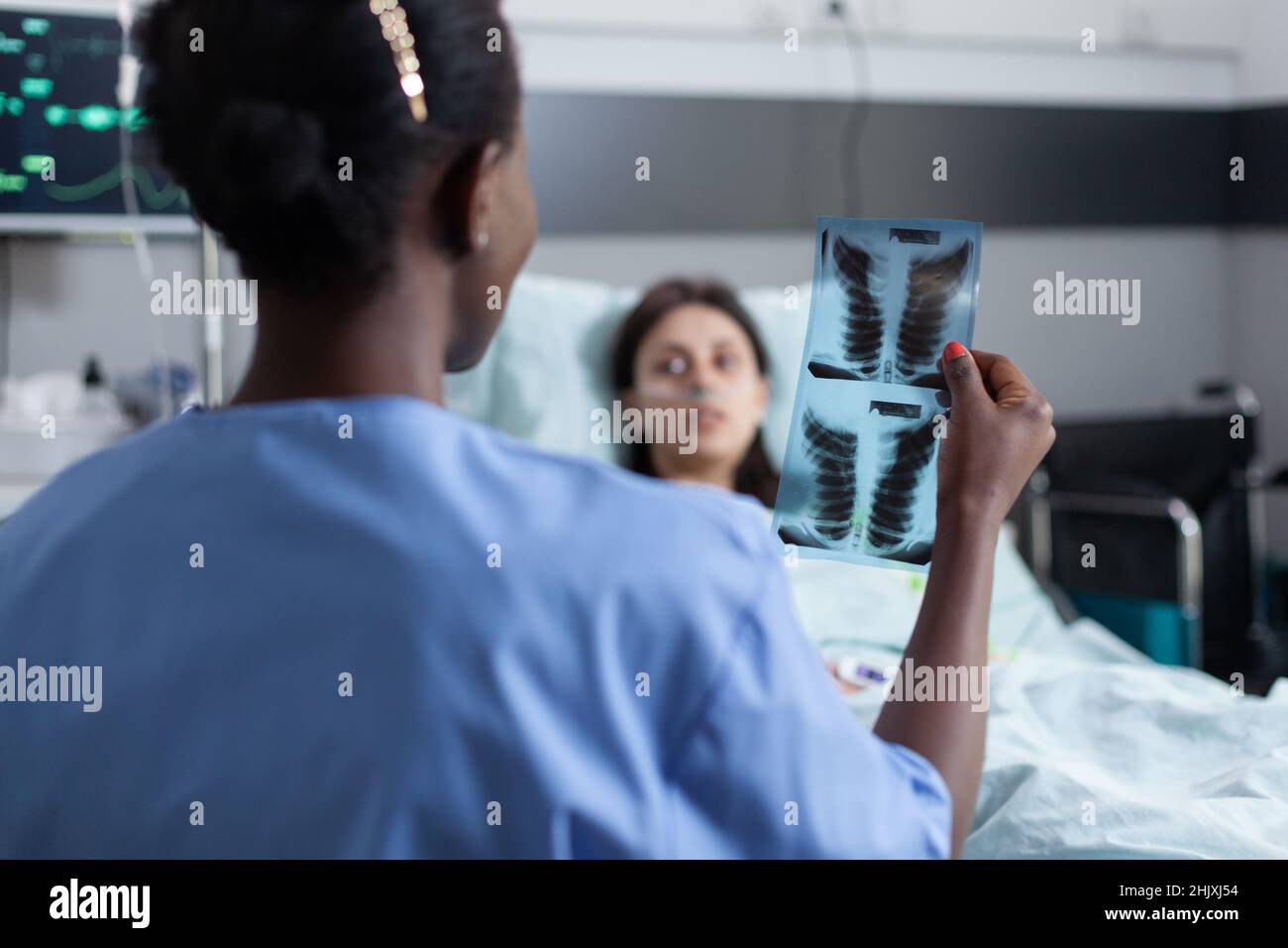 Professional nurse looking at chest xray pulmonary radiography ...