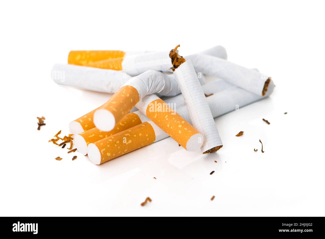 Broken cigarettes isolated on white Stock Photo - Alamy