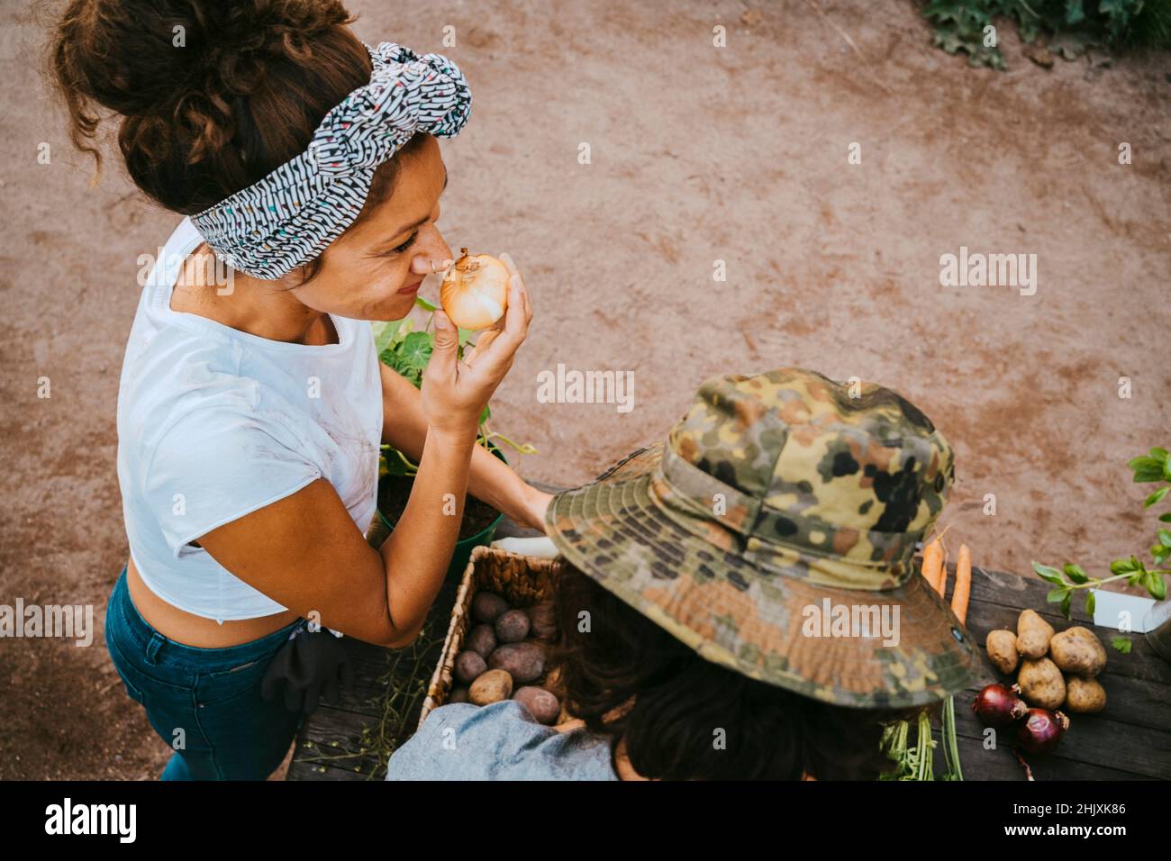 Woman smelling onion hi-res stock photography and images - Alamy