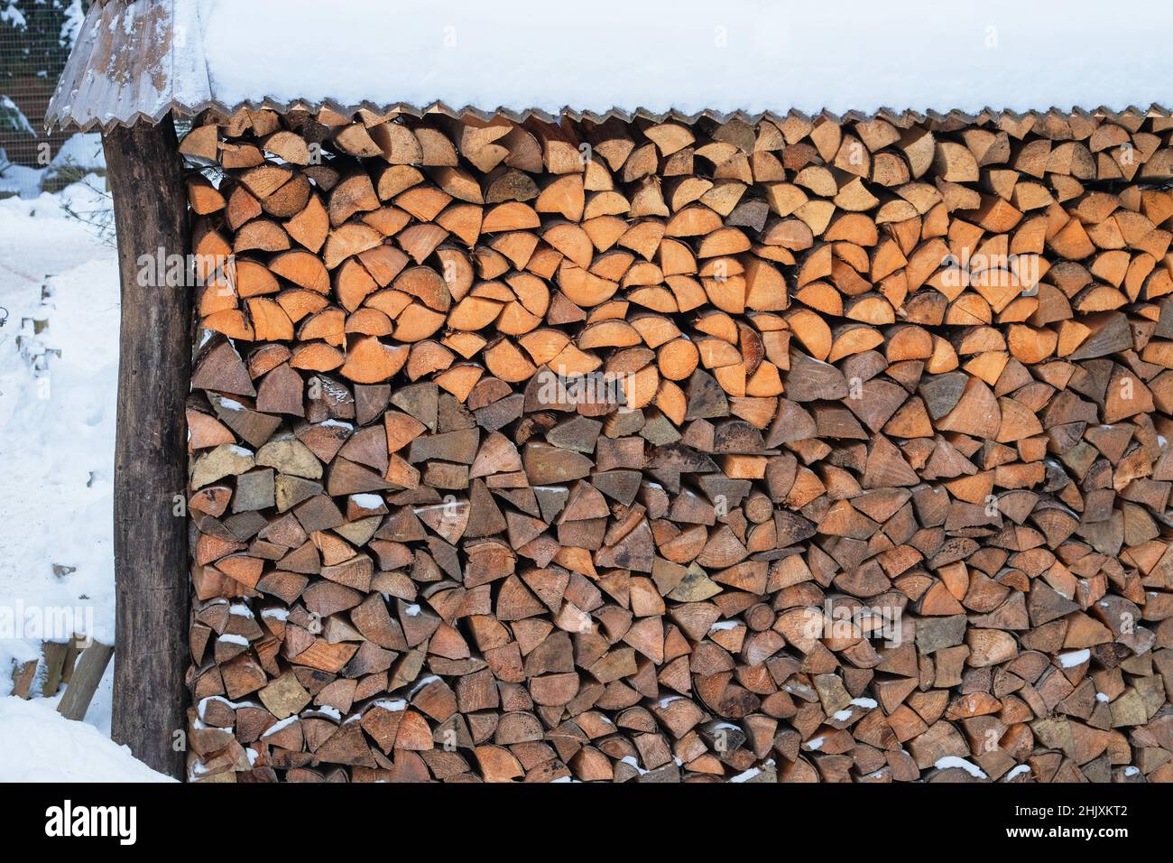 Firewood warehouse in the countryside. Firewood for the winter ...
