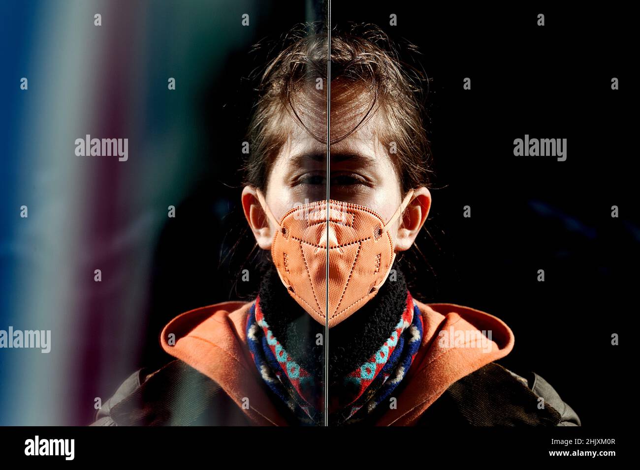 Boys face distorted in reflection Stock Photo - Alamy
