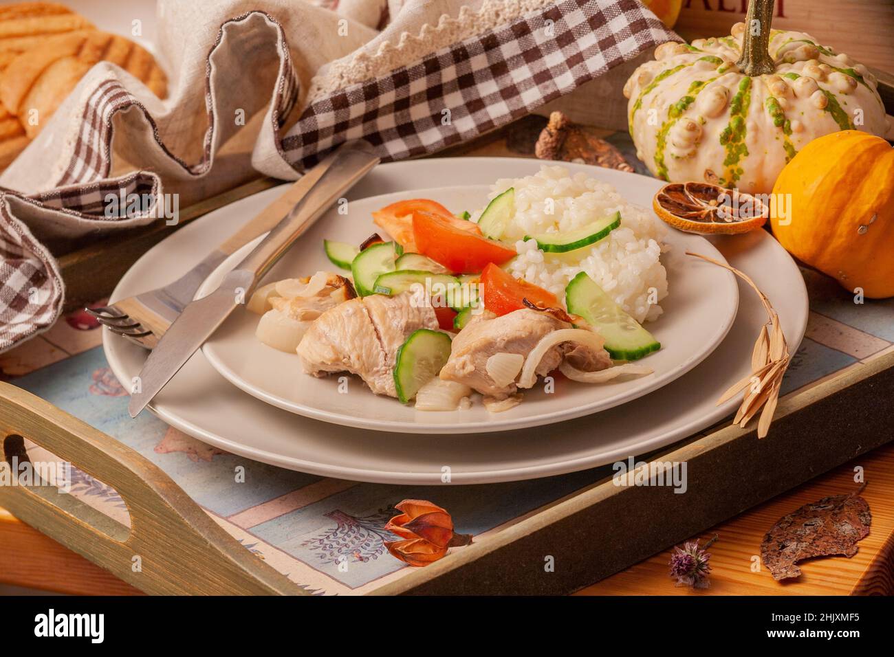 Meat with rice and vegetables on a serving tray Stock Photo - Alamy