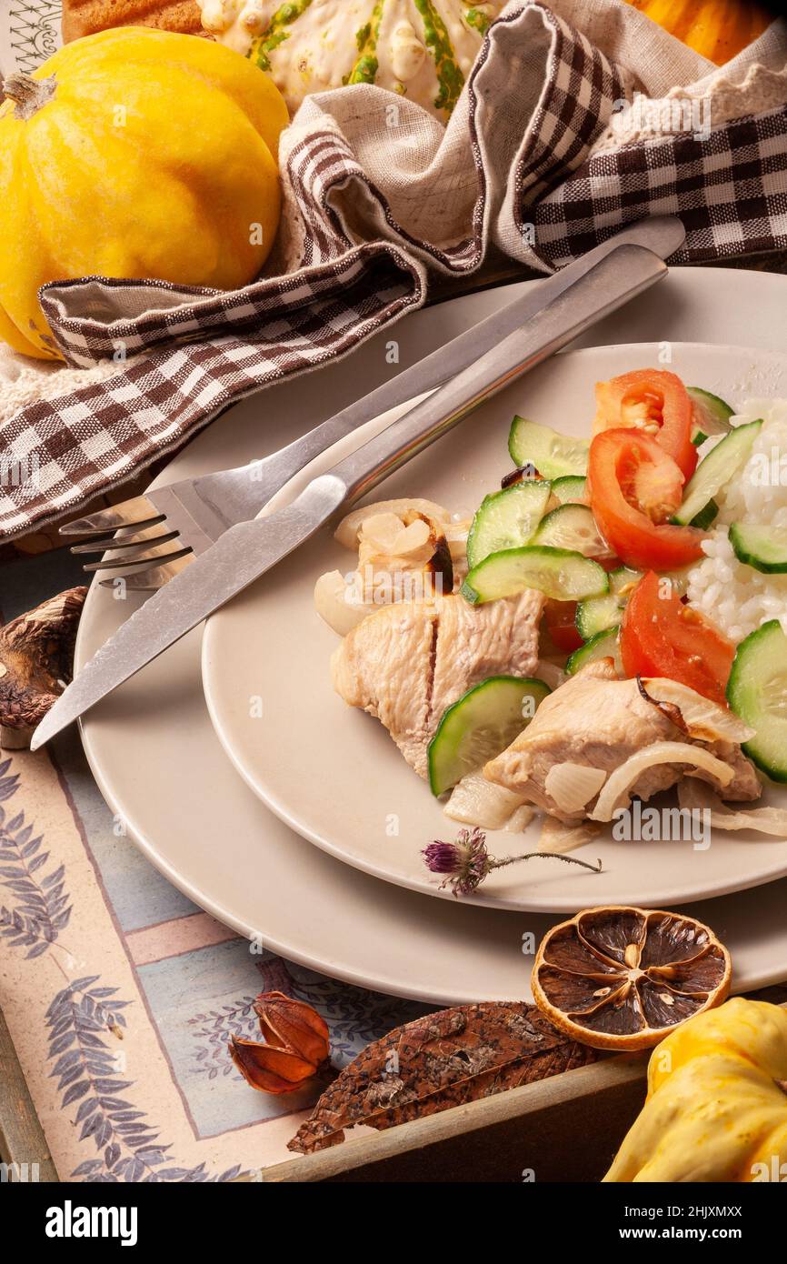 Meat with rice and vegetables on a serving tray Stock Photo - Alamy