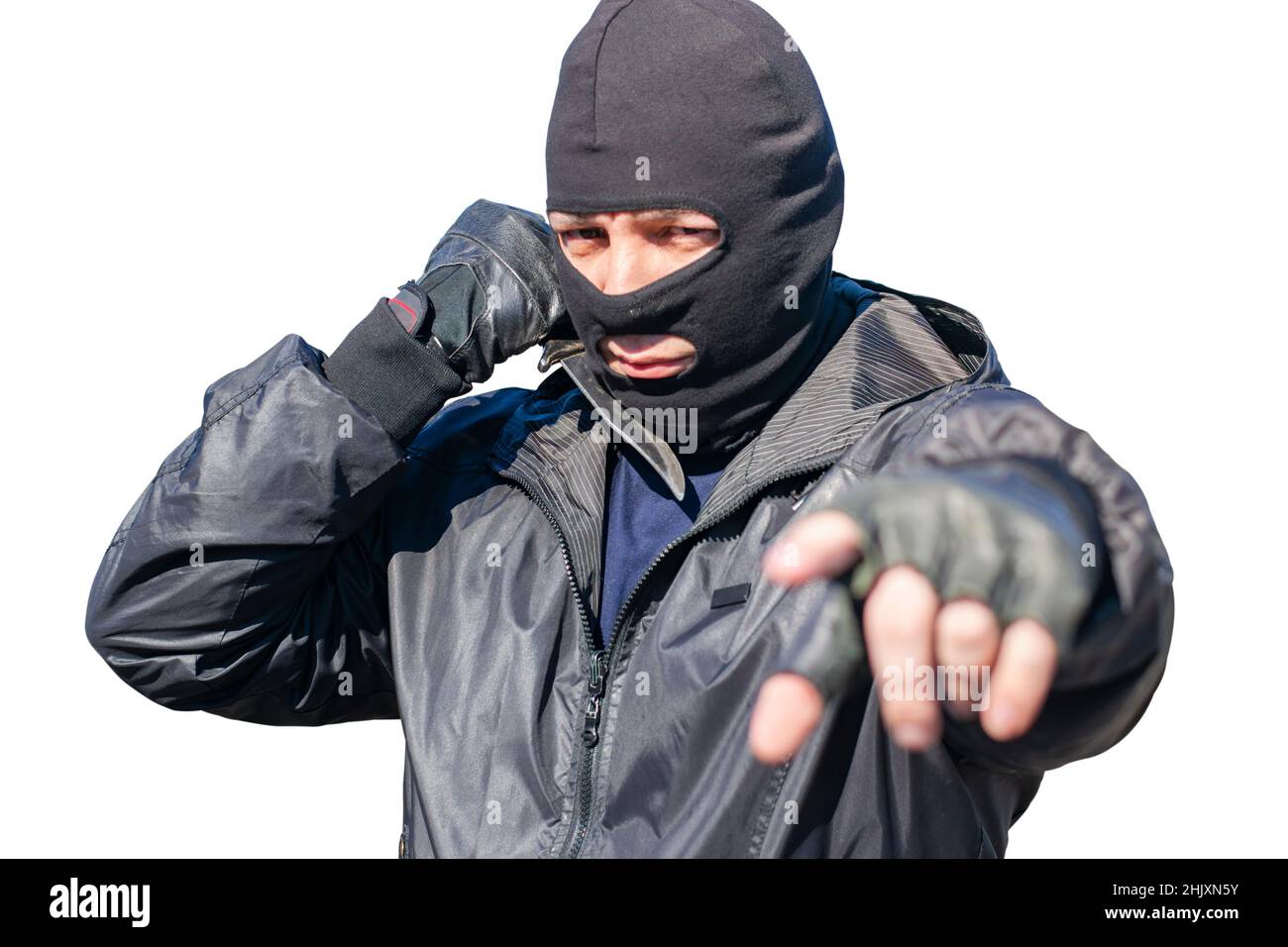 the evil face of a masked bandit on a white background Stock Photo - Alamy