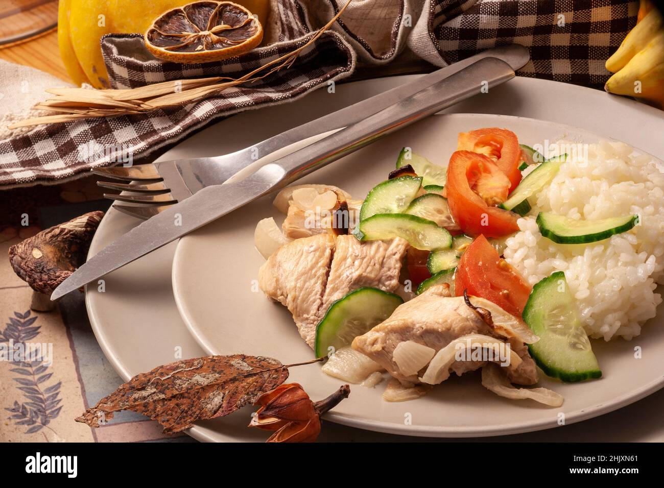 Meat with rice and vegetables on a serving tray Stock Photo - Alamy