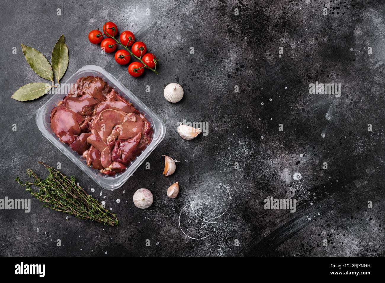 Chicken liver container set, on black dark stone table background, top ...