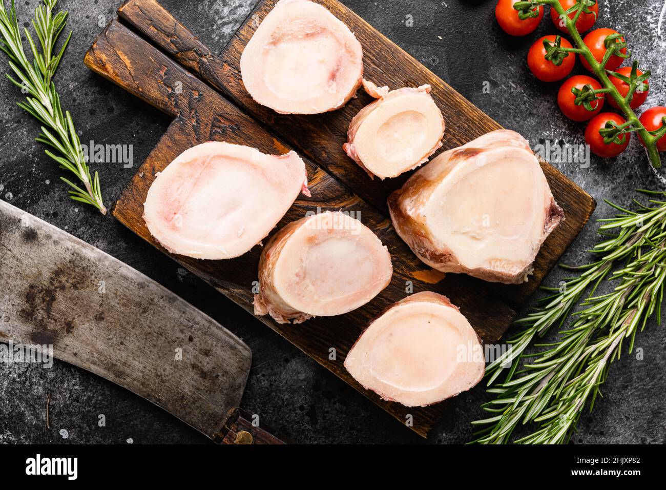 Ingredients for preparing beef broth set, on black dark stone table ...