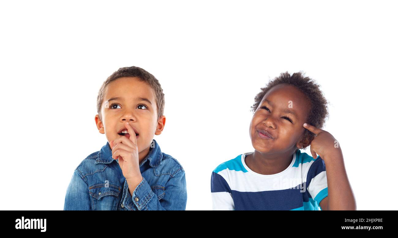 Two cute children thinking about something isolated on a white ...