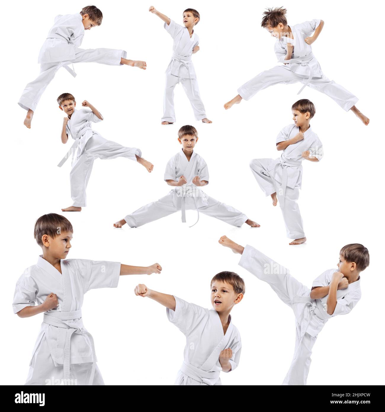 Full-length portrait of little boy, motivated sportsman in white kimono ...