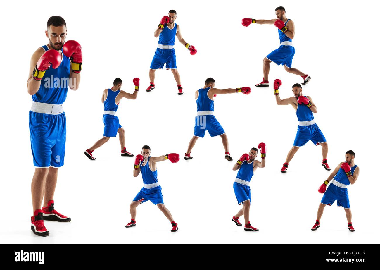 Strong fists. One professional boxer in blue uniform training isolated ...