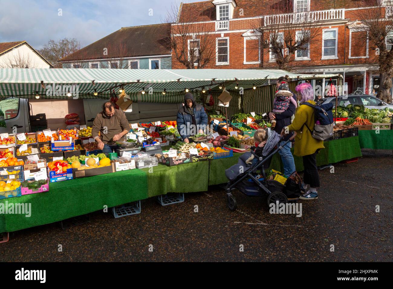 Market stall in town centre selling fruit and vegetables, greengrocer ...