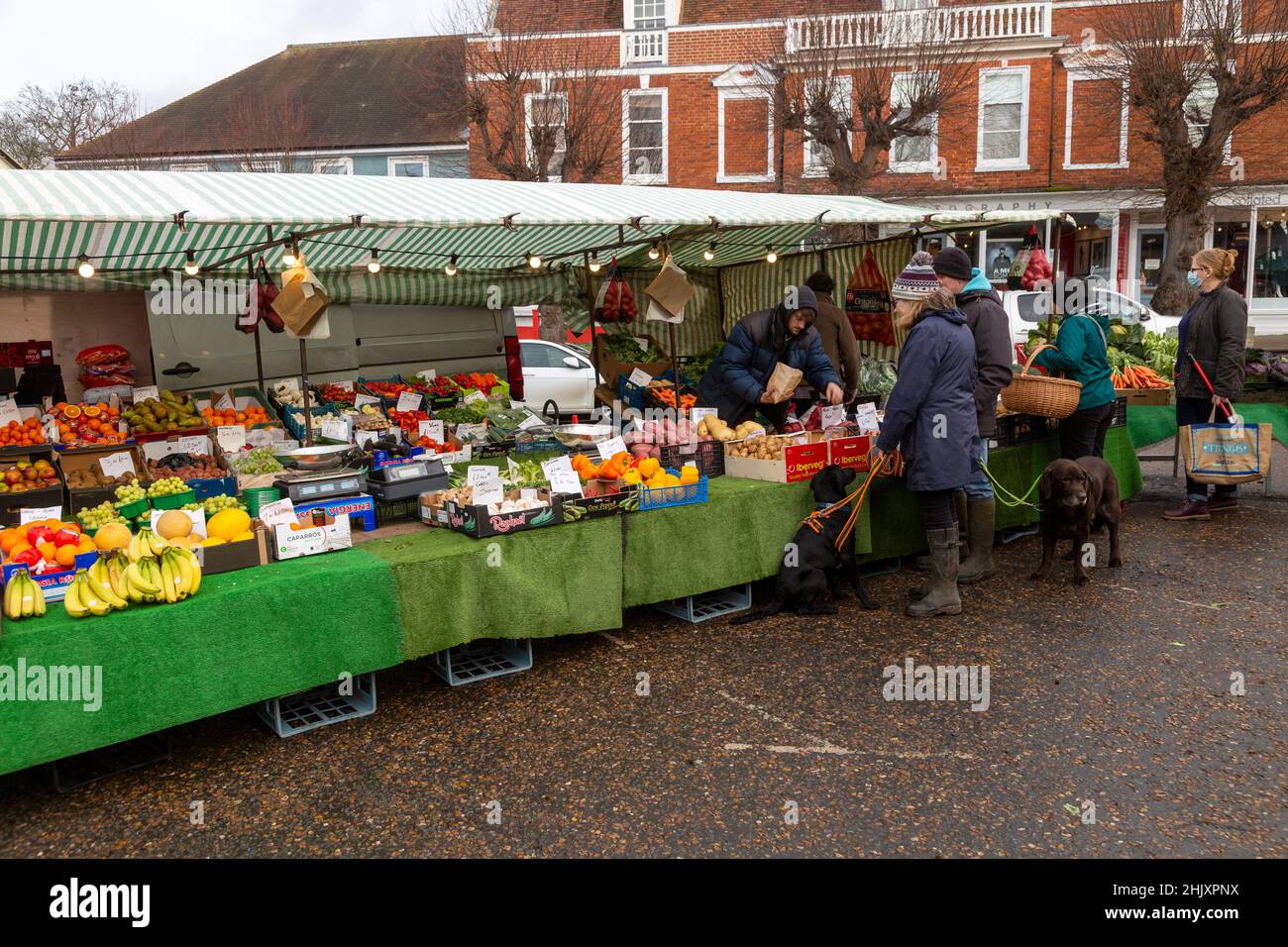 Market stall in town centre selling fruit and vegetables, greengrocer ...