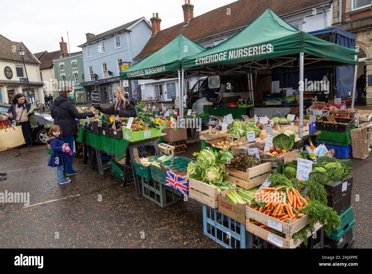 Market stall in town centre selling fruit and vegetables, greengrocer ...