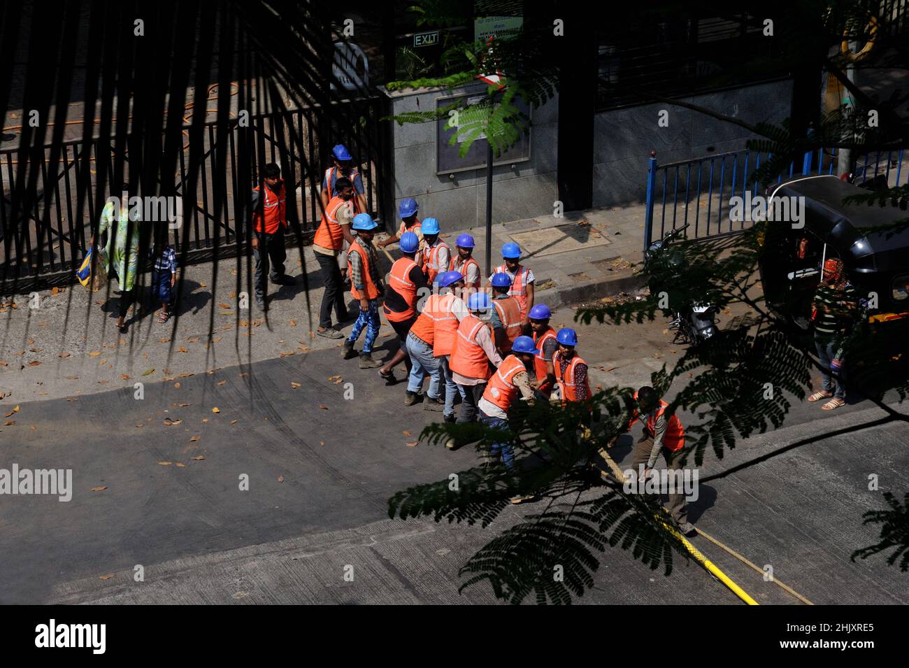 workers Pulling a fiber optic cable for fast internet and telephone ...