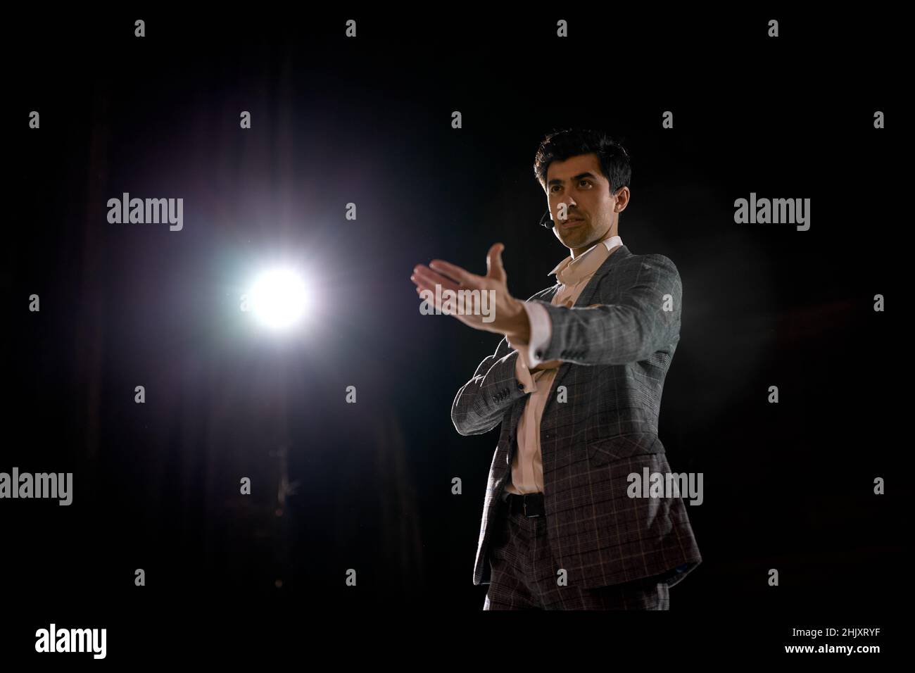 attractive and confident successful guy speaking at corporate business ...