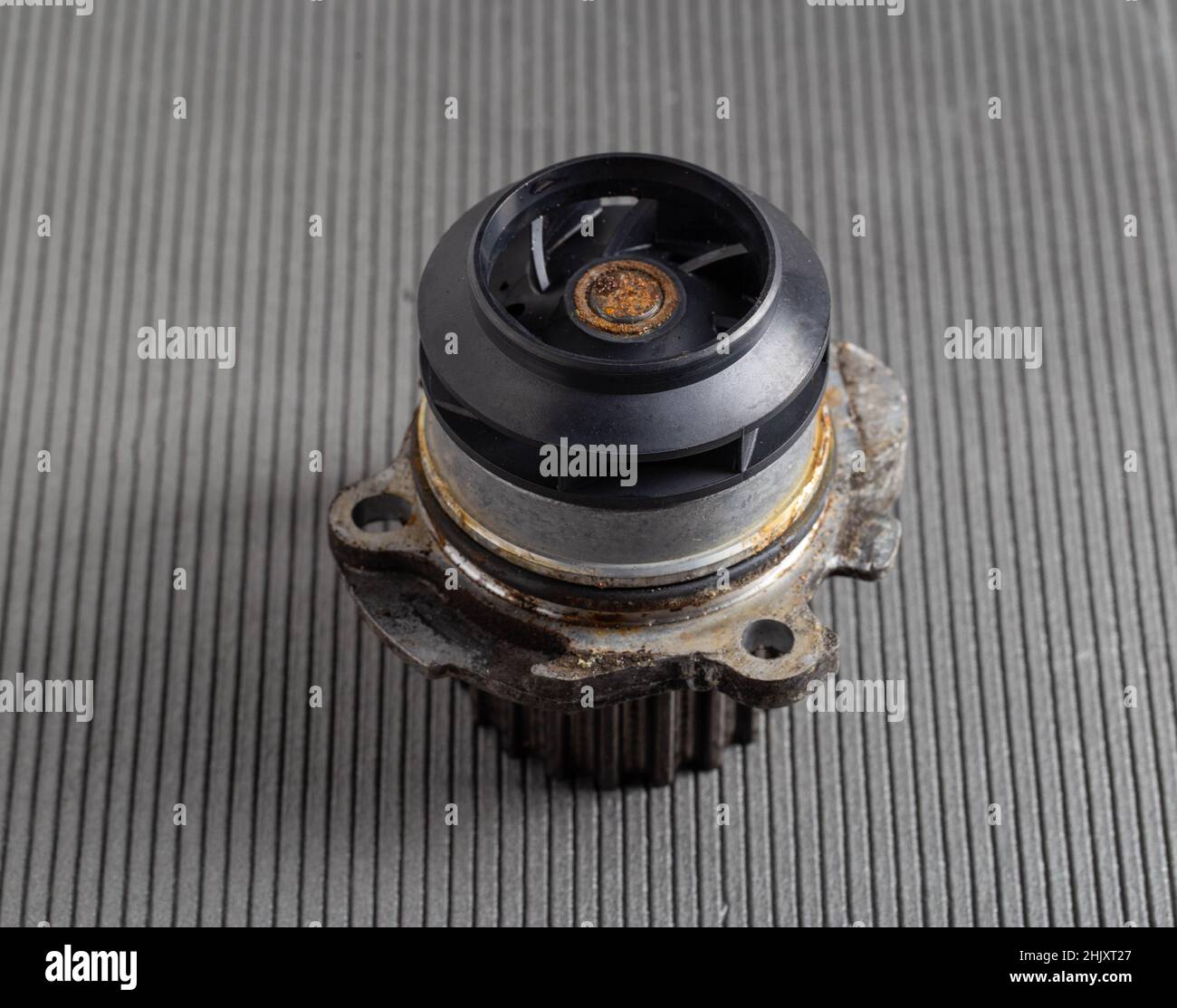 Old car pump on a gray background. The concept of repair and ...