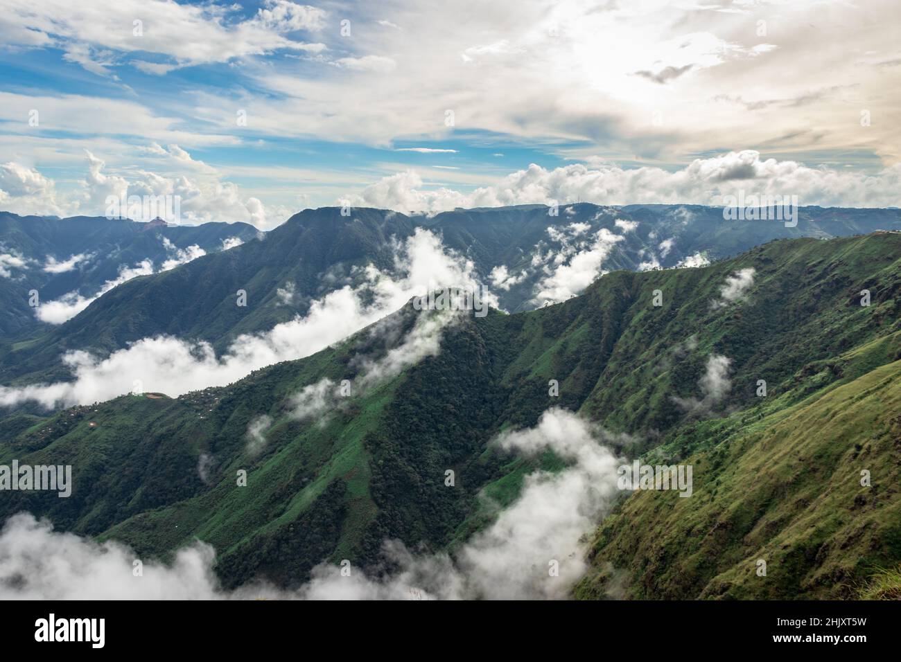 mountain range valley filled with low clouds with dramatic sky at ...