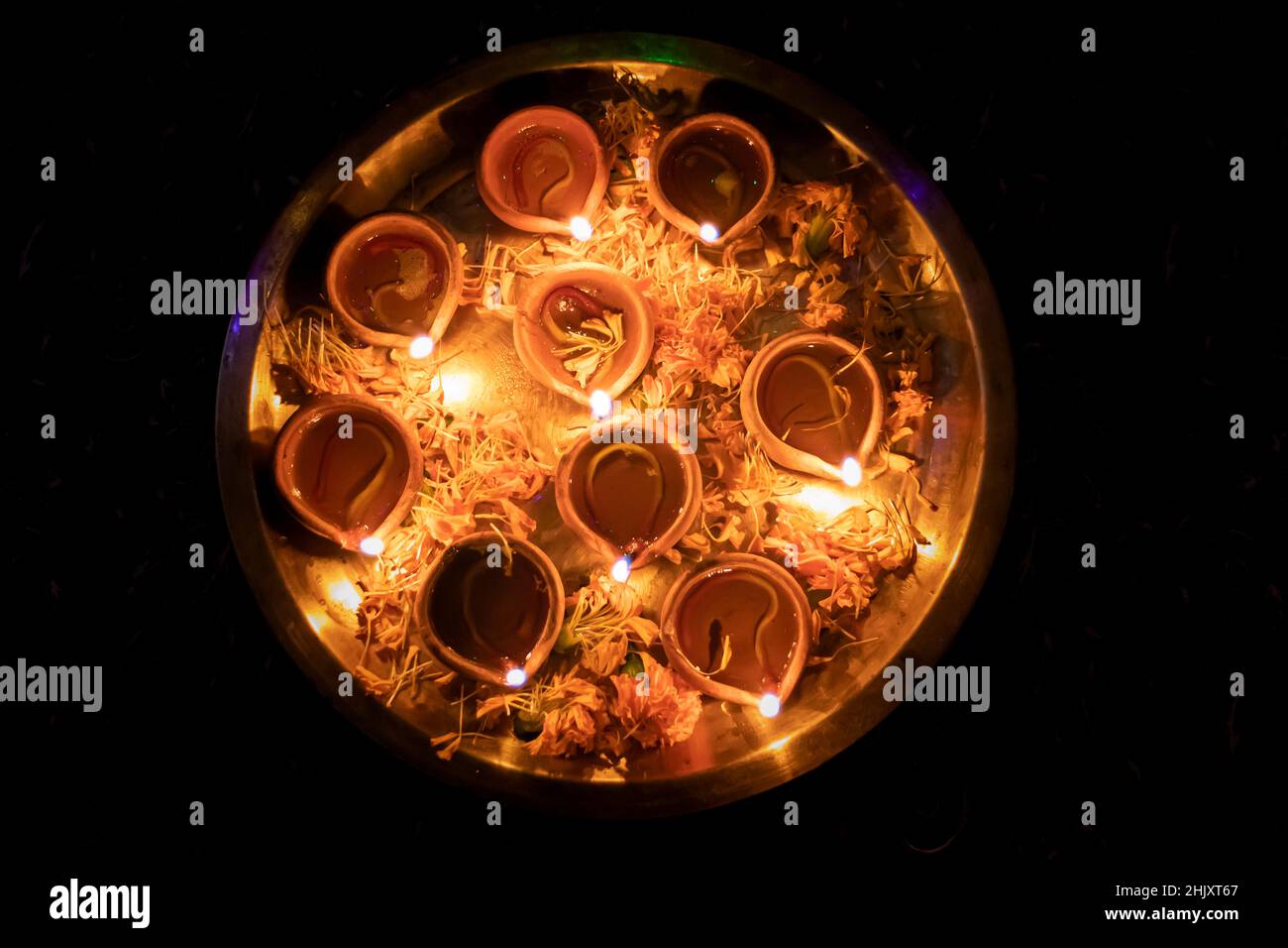 oil lamps many in plate isolated with with black background for ...