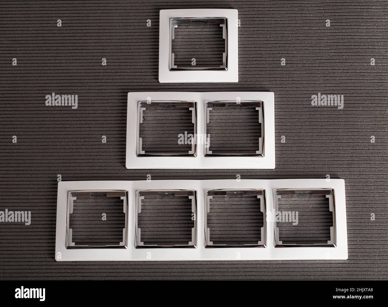 Modern frames for sockets on a gray background Stock Photo - Alamy