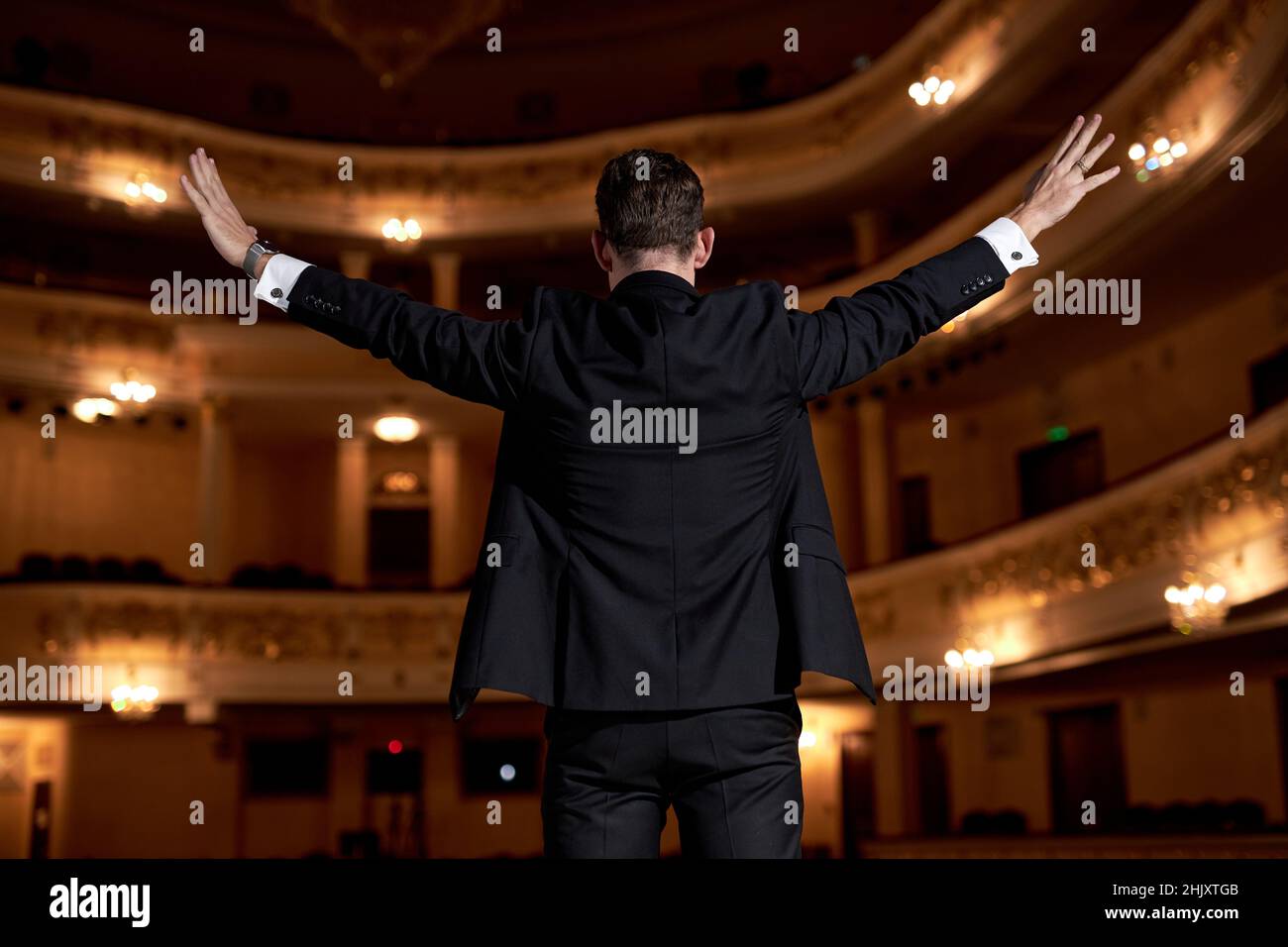 Famous American Entertainer Stands on Stage, Greets Audience, Starts ...