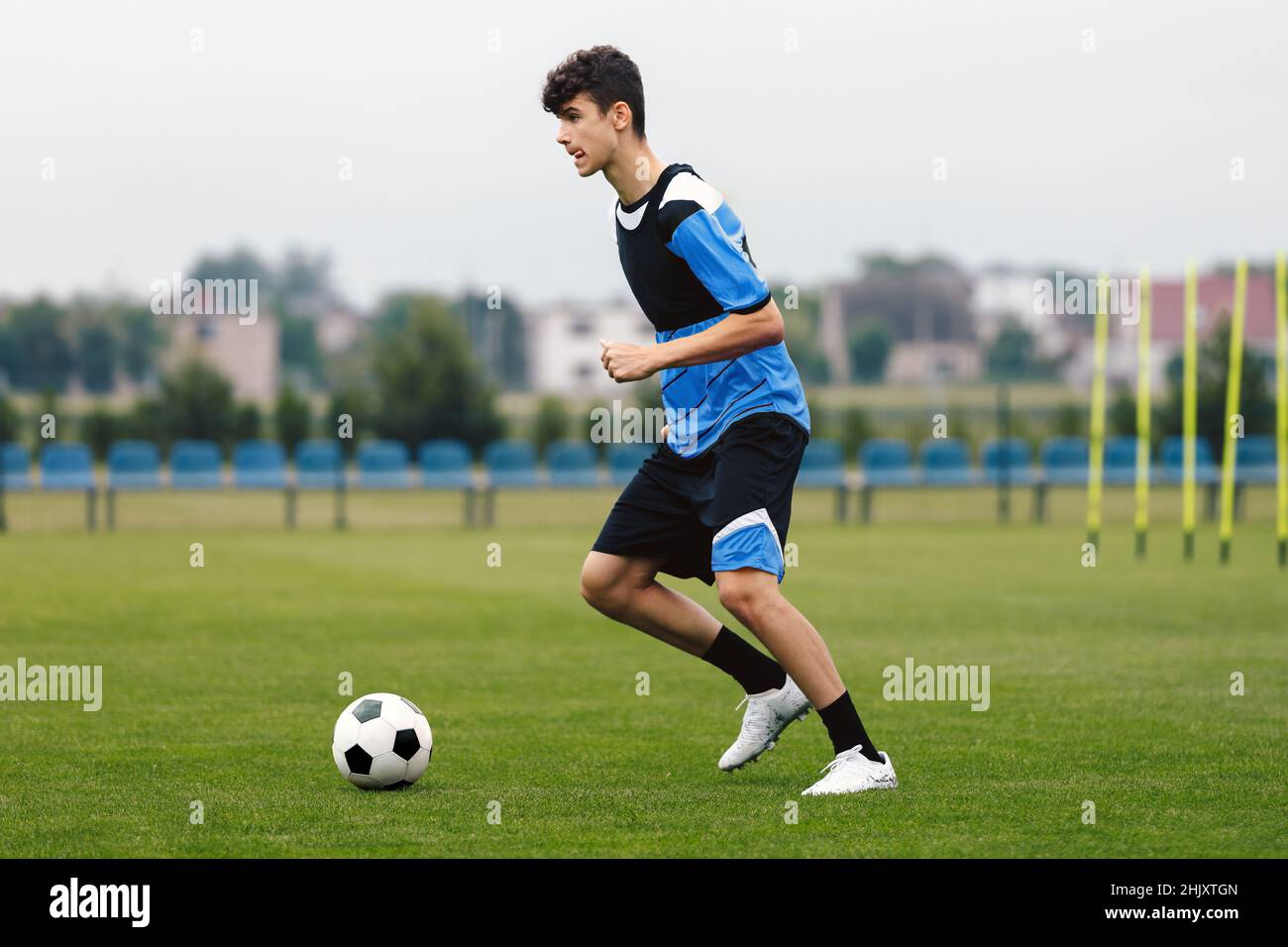 Young Footballer Running Ball During Soccer Training Unit. Football ...