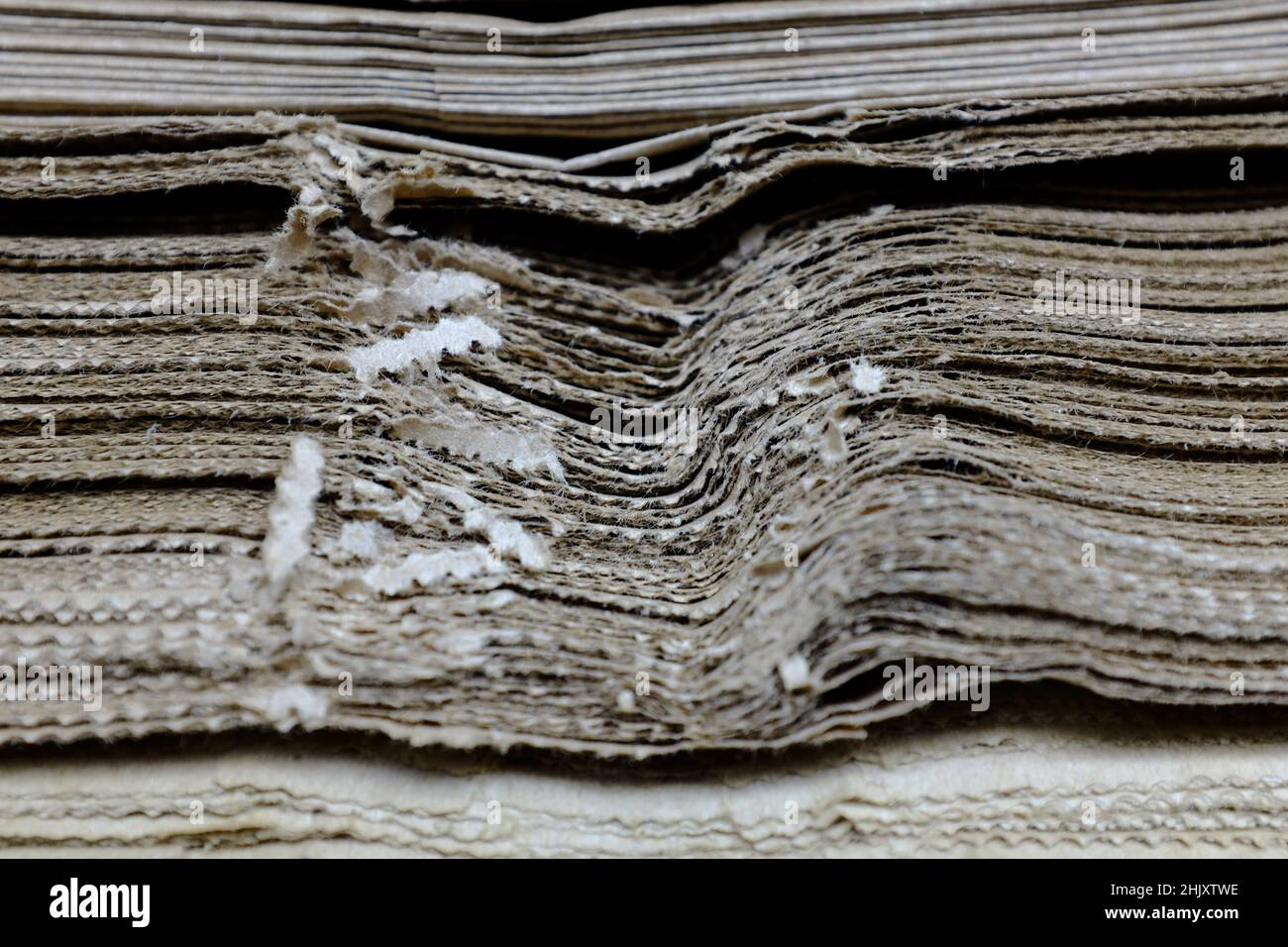 Closeup of a stack of the damaged cardboards - wallpaper Stock Photo ...