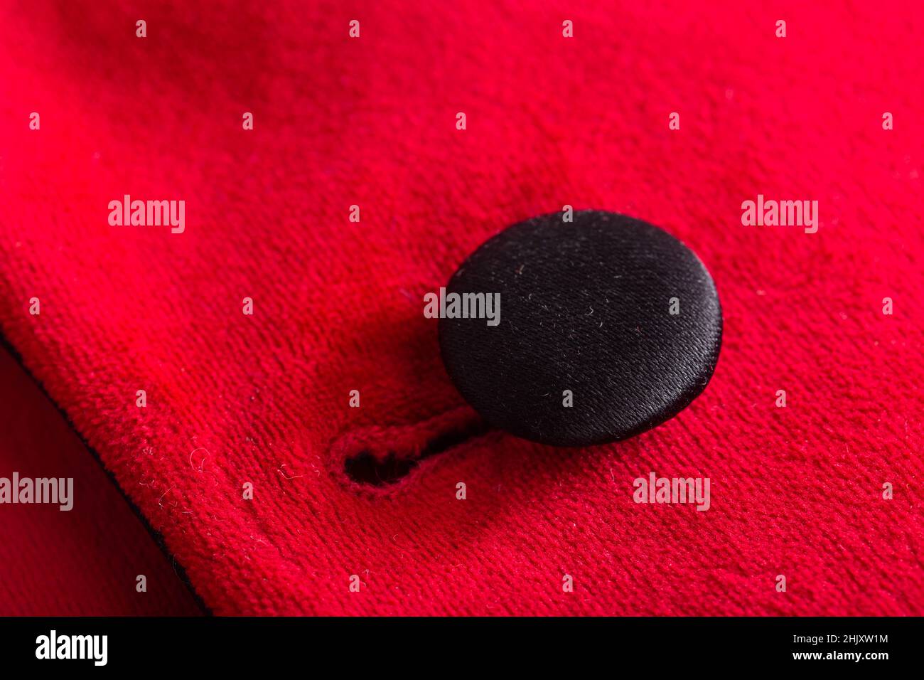 Red stylish jacket with buttons, background. Stylish clothes, macro ...