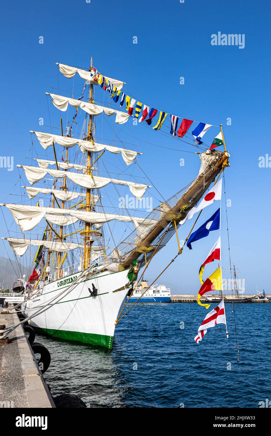 View of a white tall ship with different flags in the harbor Stock ...