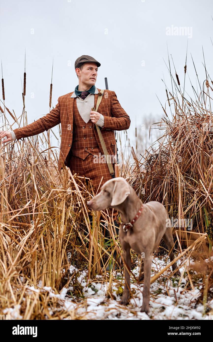 Autumn hunting season. Hunter with shotgun gun on hunt. Autunm hunting ...