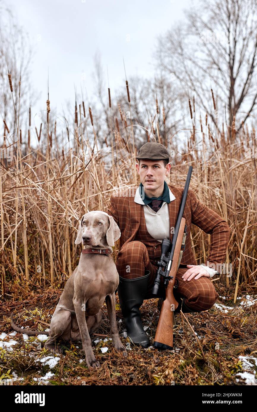 Handsome hunter male hunt on ducks and wild animals in autumn, in ...