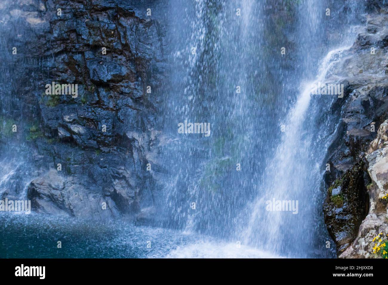 waterfall falling streams through rocks in forest at morning from flat ...