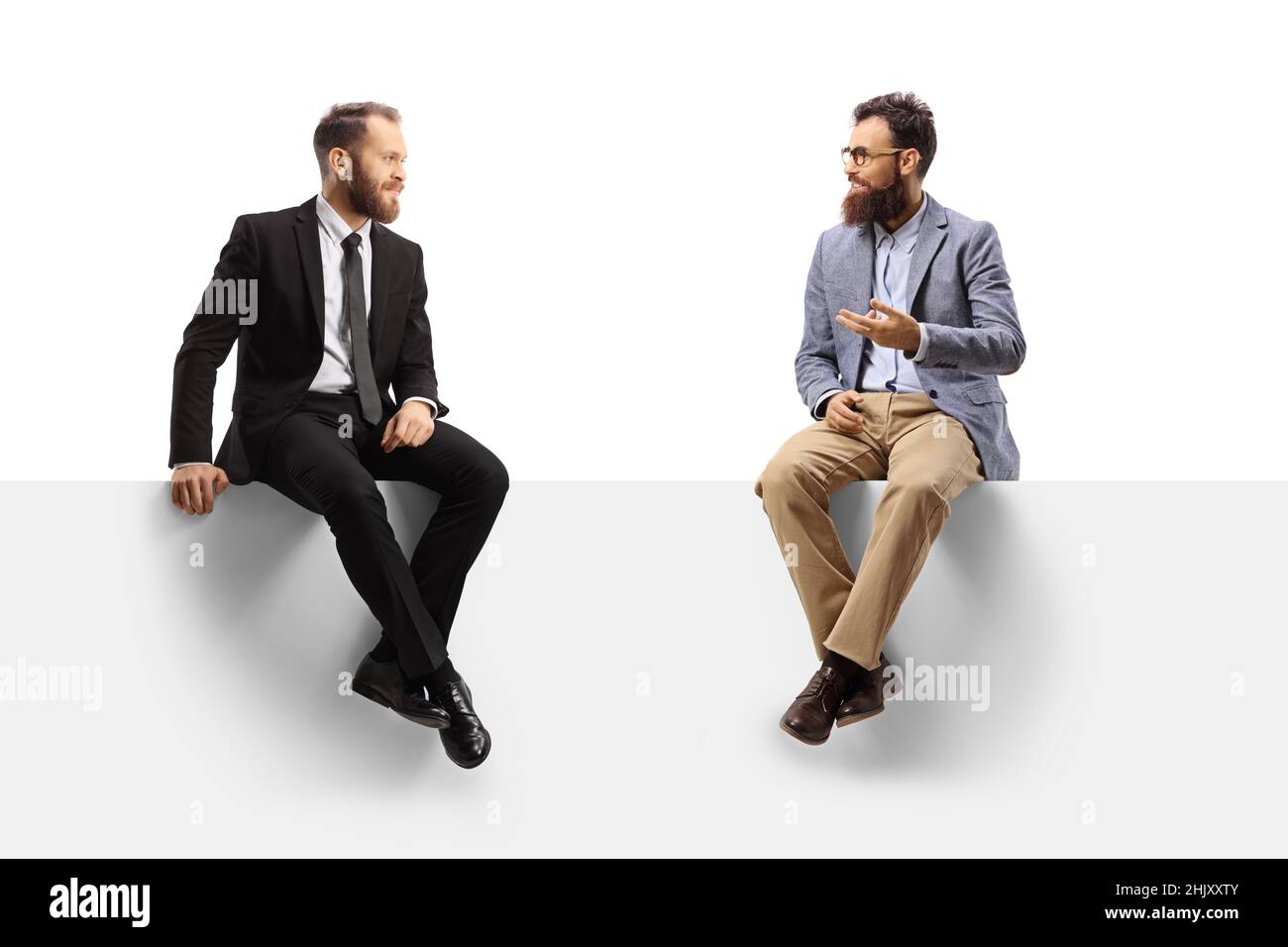 Two men sitting on a white panel and having a conversation isolated on ...