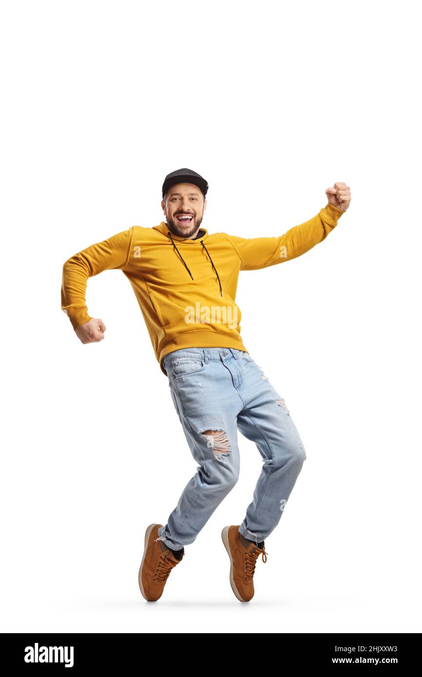 Full length portrait of a cheerful young casual man dancing isolated on ...