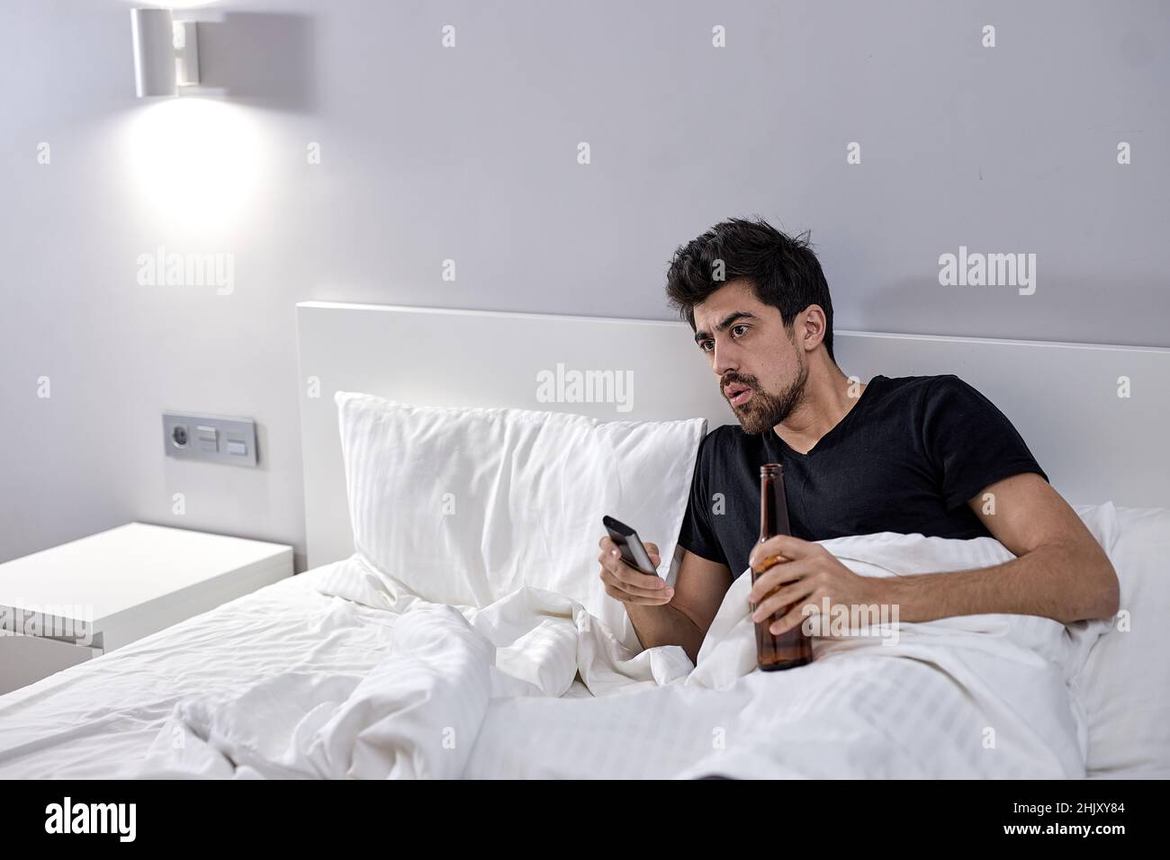 Grumpy man in bed hi-res stock photography and images - Alamy
