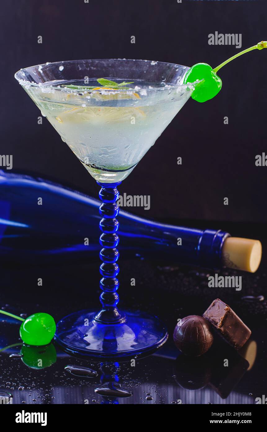 refreshing alcoholic cocktail in a glass with a cherry Stock Photo - Alamy