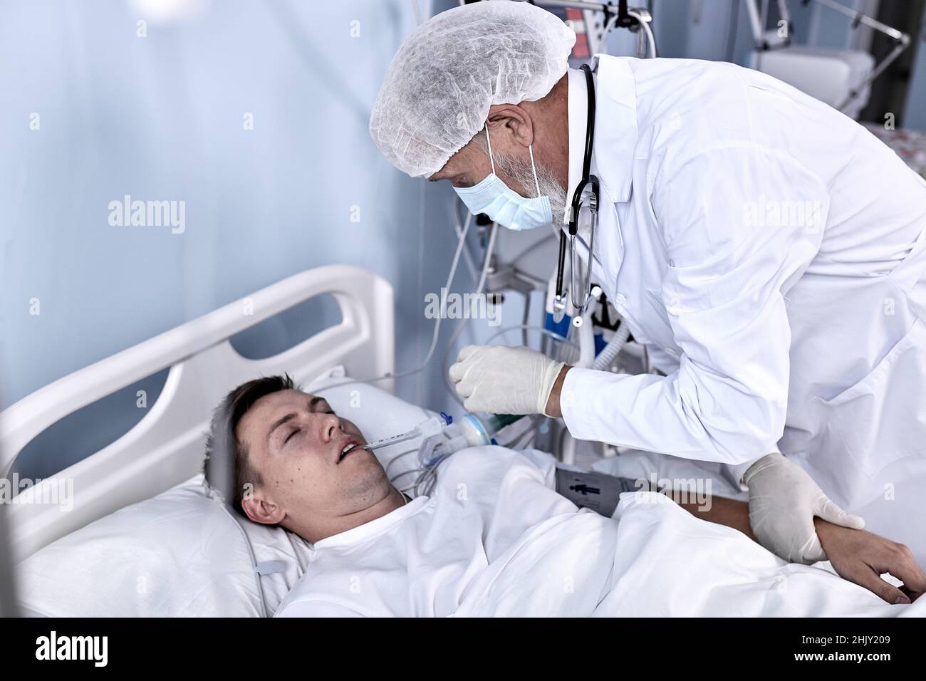 Experienced Male Doctor Check the Pulse and the Patient's Health ...