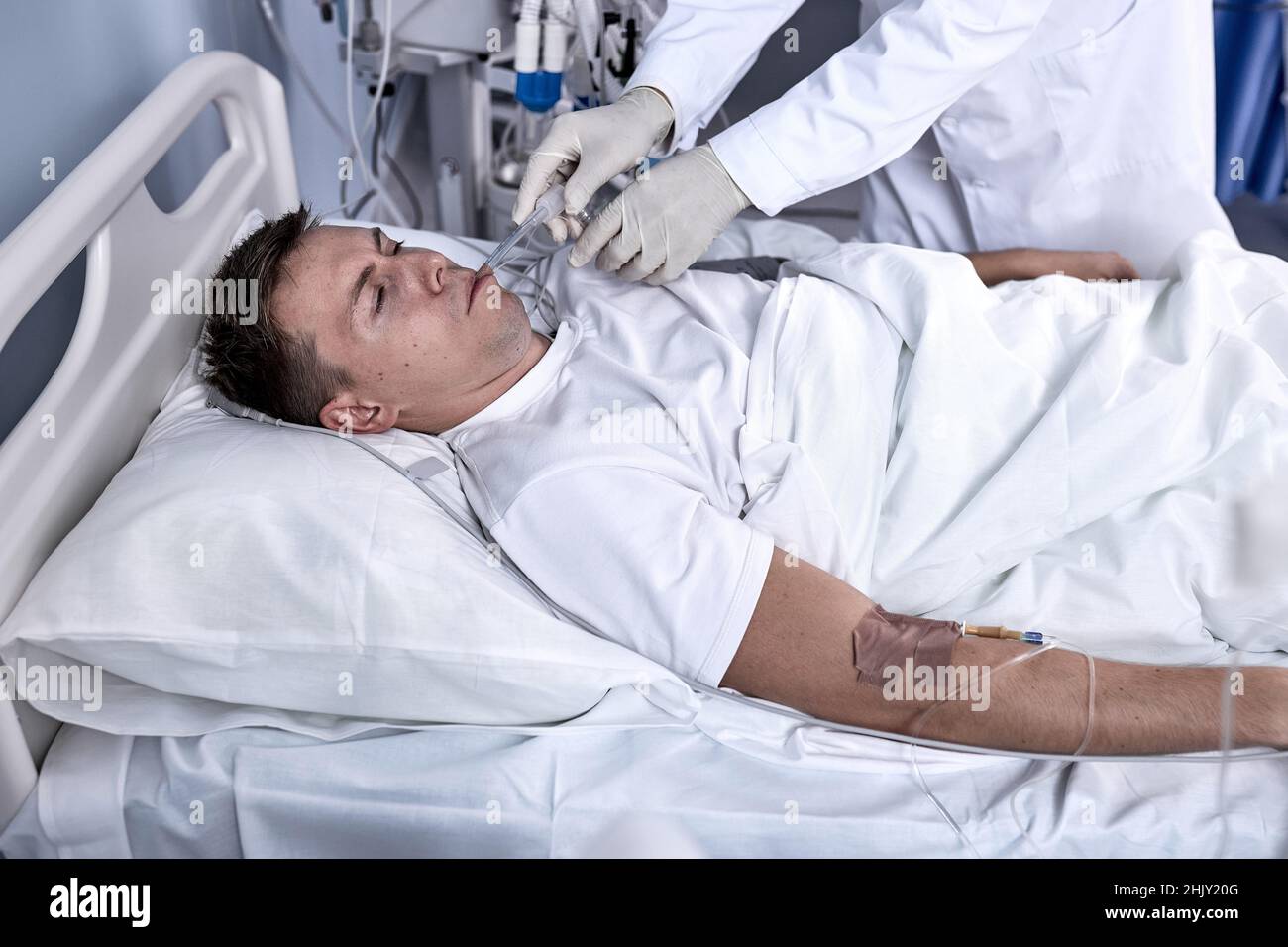 injured man lying in bed hospital room in bad health condition after ...